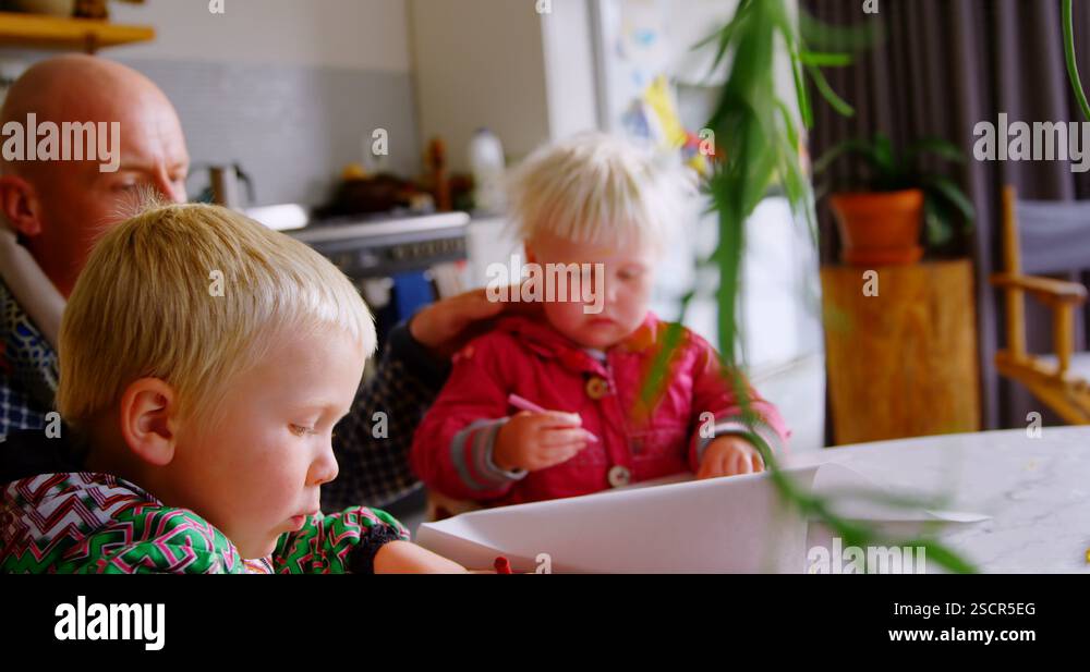Father taking care of his children at home 4k Stock Video Footage - Alamy
