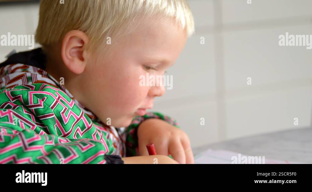 Boy drawing with crayon on a paper at home 4k Stock Video Footage - Alamy