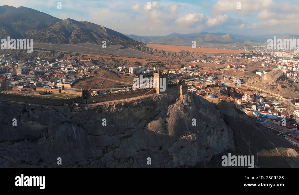 Ancient medieval Genoese fortress tower on mountain range rocks above ...