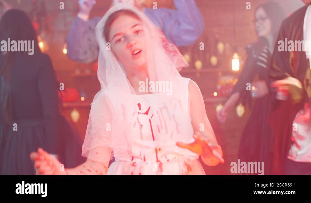 Girl in evil dead bride costume at a halloween party Stock Video ...