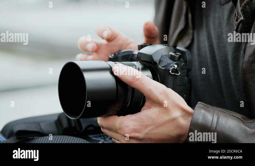 Close-up of the hand of a male tourist who sets up a camera Stock Video ...