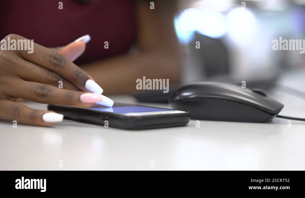Girl scrolling social media at work desk 4k Stock Video Footage - Alamy