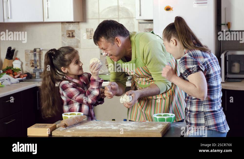 father cheers up daughters and jaws small thick dough pieces Stock ...