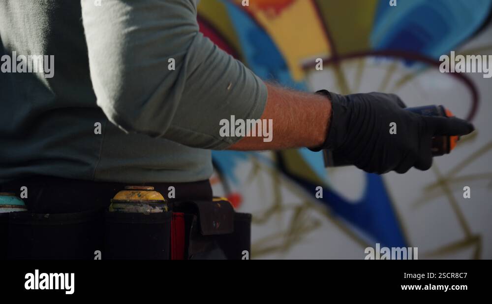Graffiti artist looking at wall in the sunshine 4k Stock Video Footage ...