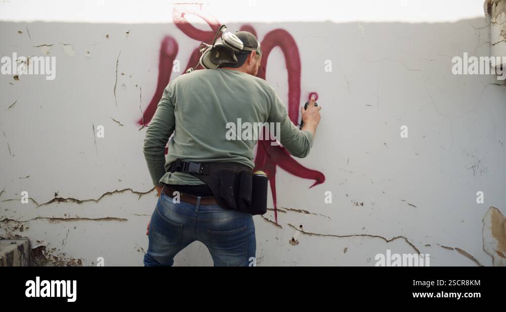 Graffiti artist painting with aerosol spray 4k Stock Video Footage - Alamy