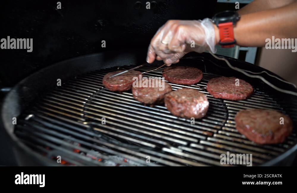 Chef using food thermometer and measuring burgers temperature on ...
