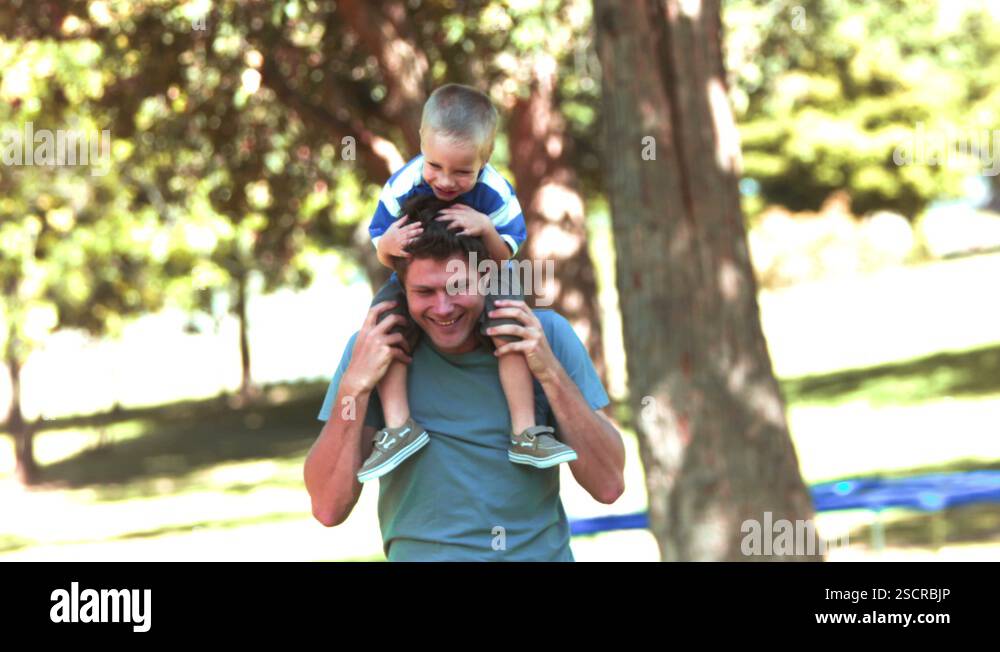 Father in slow motion holding his son Stock Video Footage - Alamy