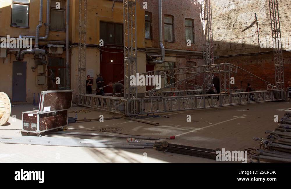 Male workers technically prepare the stage for the big concert among ...
