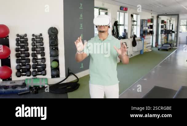 Man in rehabilitation center using VR headset for physical therapy ...