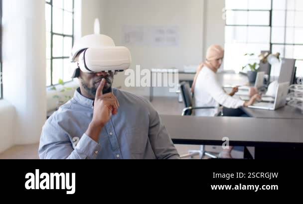 Using VR headset, man interacting with virtual interface in modern ...