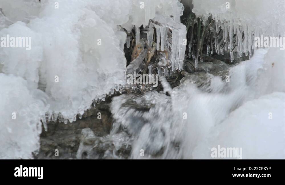 Icicles forming on a small waterfall during a cold winter in Sweden ...
