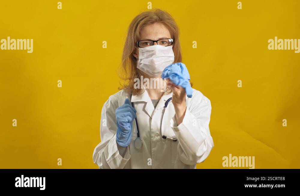 Young woman doctor. Yellow background. The concept of medicine Stock ...