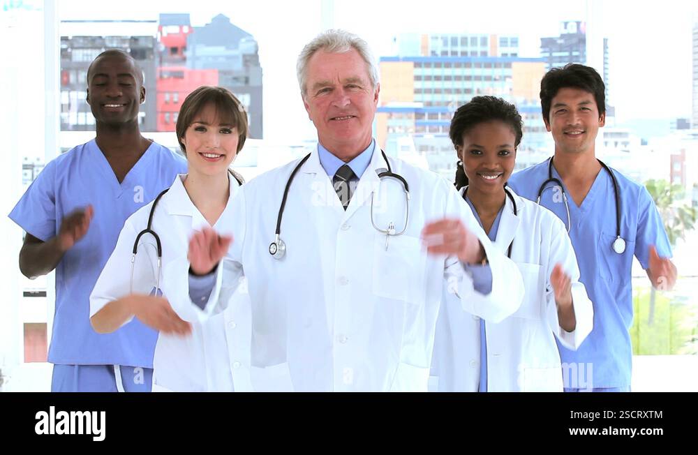 Medical team clapping their hands Stock Video Footage - Alamy