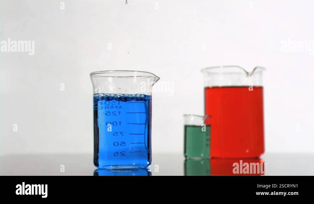 Syringe in a super slow motion falling on a blue beaker Stock Video ...