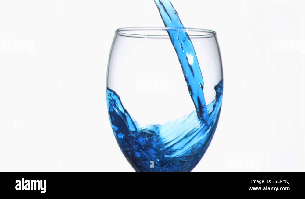 Blue trickle in super slow motion flowing in a wineglass Stock Video ...