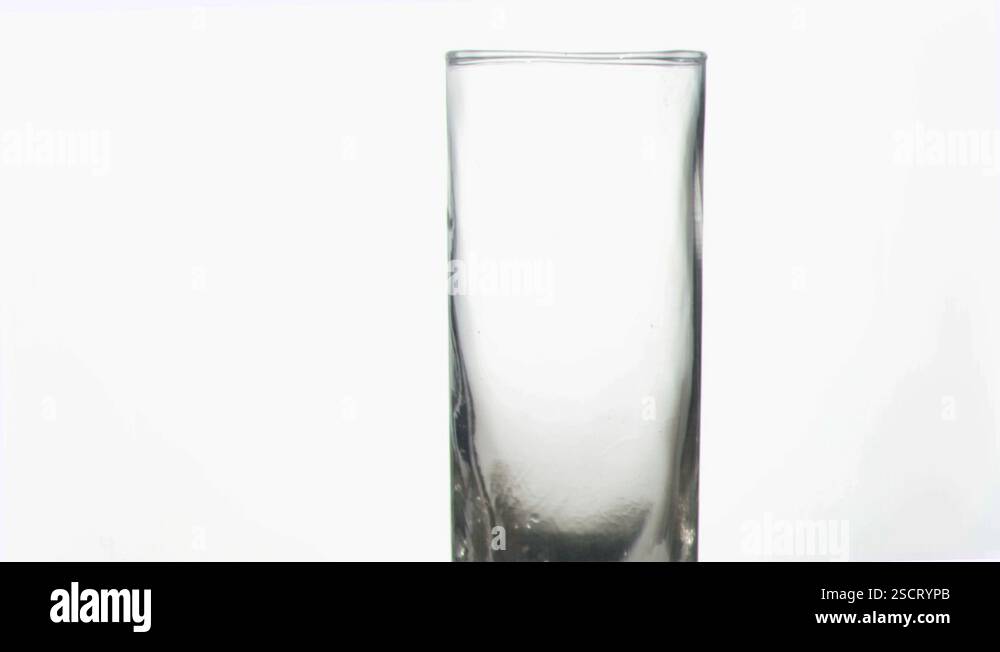 Thin blue trickle in super slow motion flowing in a glass Stock Video ...