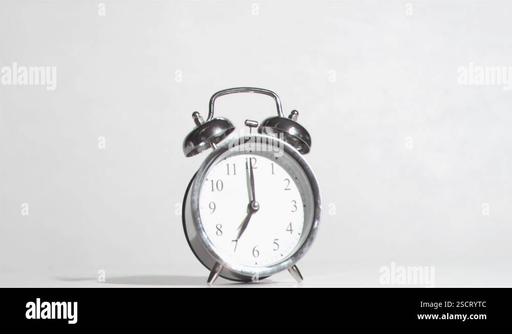 Alarm clock sounds in a super slow motion crushing by a hammer Stock ...
