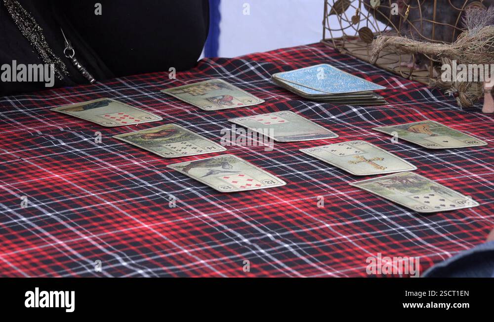 fortune teller woman with hat read tarot cards about client future. 4K ...