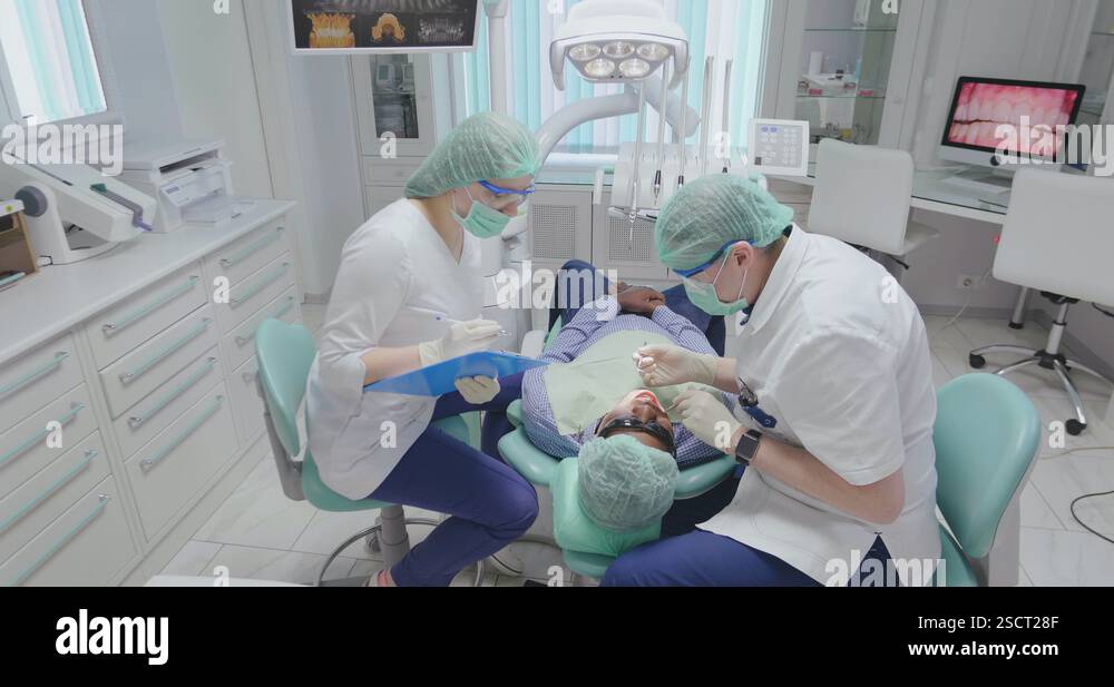 filling out medical card at dentist by assistant Stock Video Footage ...
