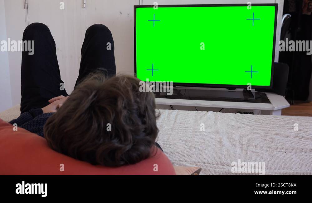 Man In Bed Watching TV Green Screen, Zoom In Stock Video Footage - Alamy