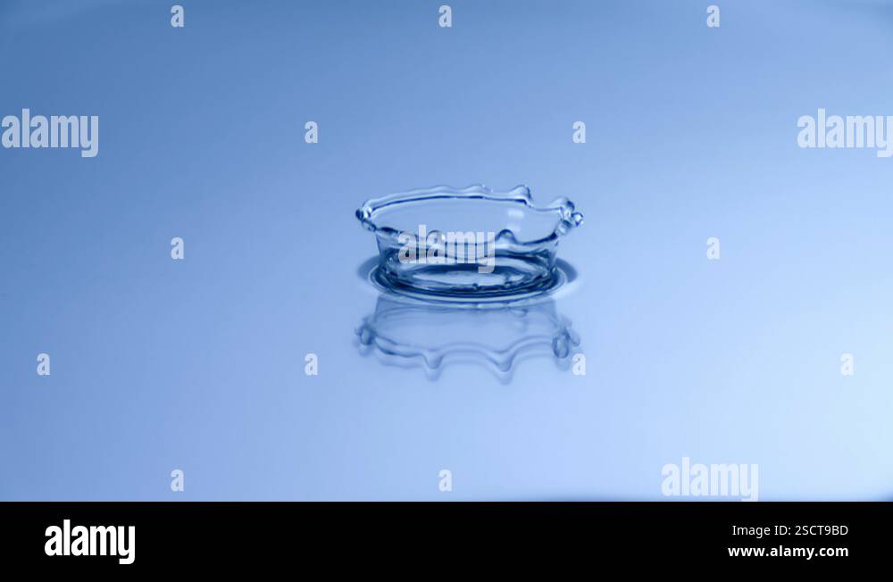 Slow motion Water drop splash into calm water Stock Video Footage - Alamy