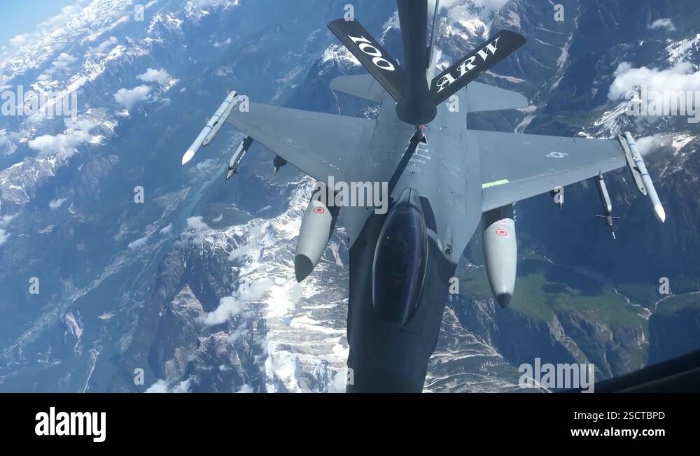 F-16 Fighting Falcon conducts aerial refuel above mountains of Italy ...