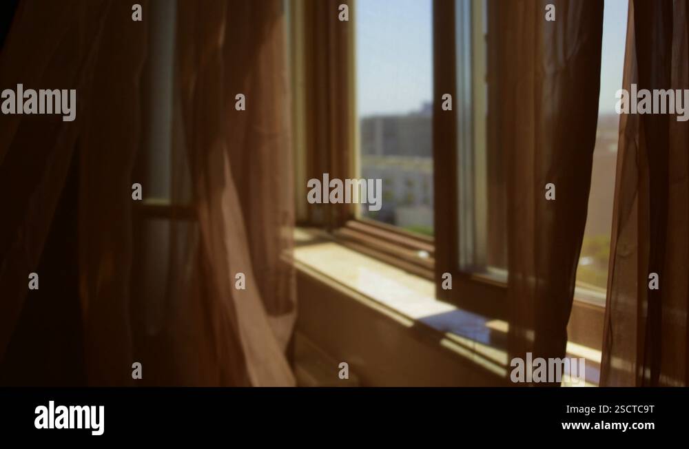 Moving brown transparent voile at wide open window Stock Video Footage ...