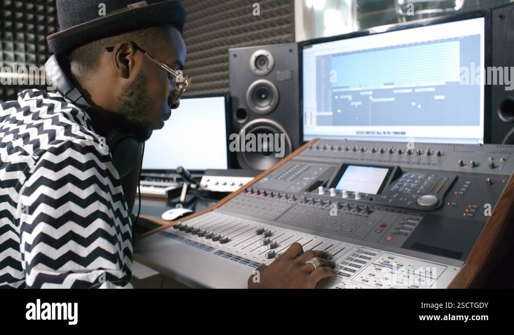 Stylish Sound Engineer Using Mixing Desk Stock Video Footage - Alamy