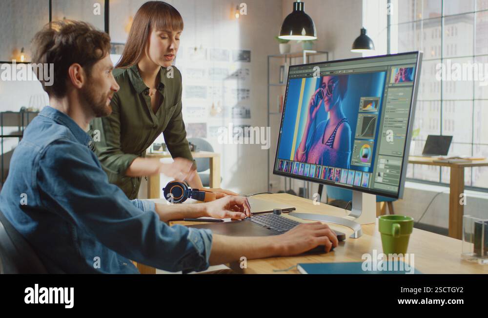 Female Art Director Consults Designer Colleague, They Work in Editing ...