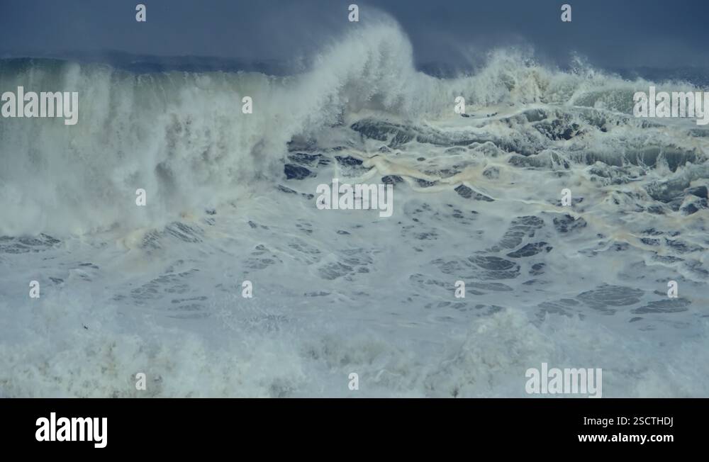 Big ocean sea waves crashing on coast during storm effect of climate ...