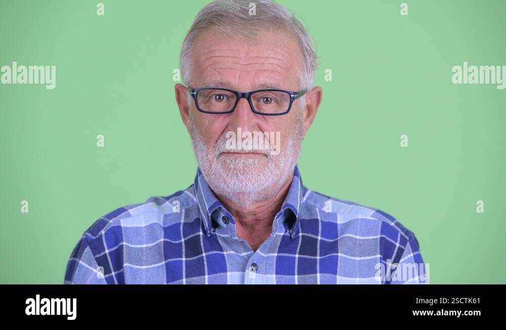 Face of happy senior bearded hipster man nodding head yes Stock Video ...