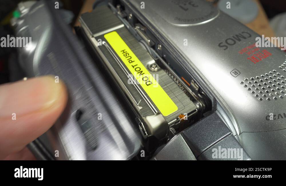 Changing a video tape cassette in a HDV mini DV video camera Stock ...
