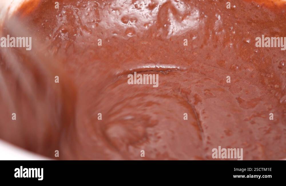 Mixing ingredients together in a white mixing bowl Stock Video Footage ...