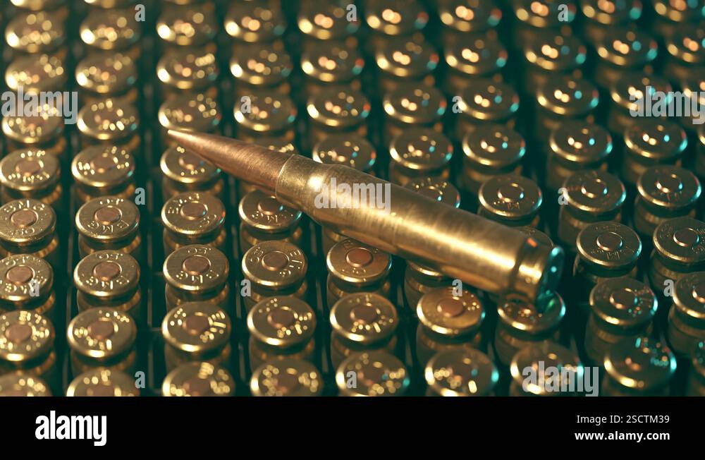 Rows of .50 BMG machine gun ammunition in plastic container. One bullet ...