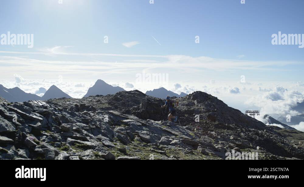 Man run on cliff edge.Trail runner running to mountain top peak ...