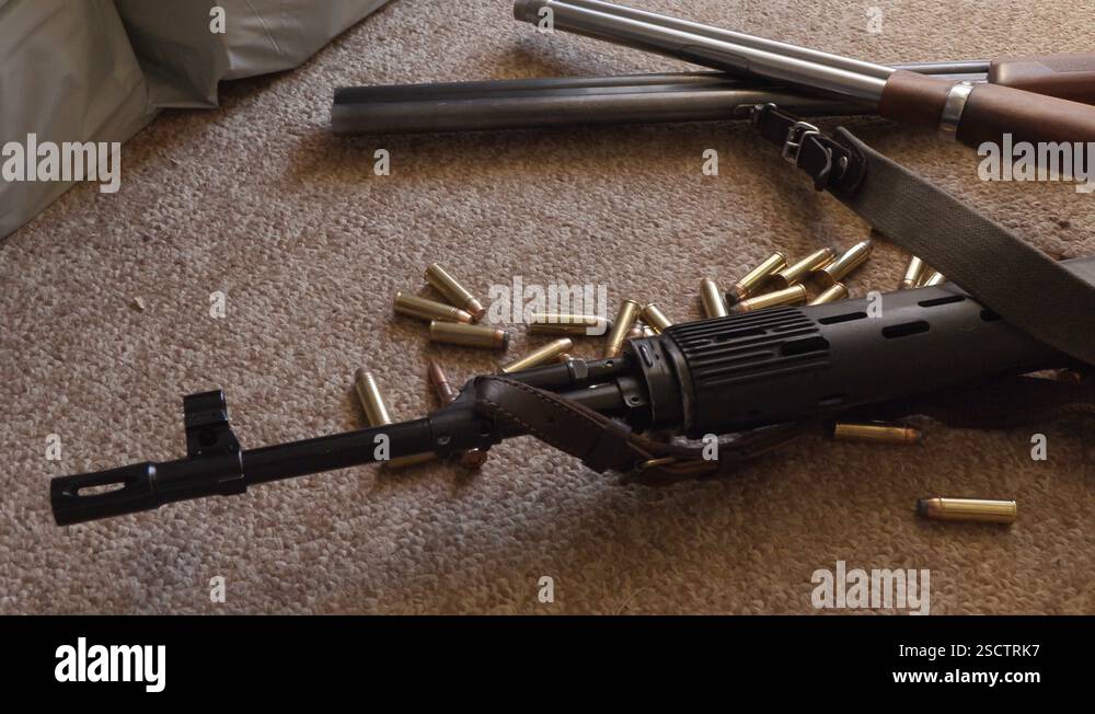 weapons and ammunition close-up on the carpet. Smooth camera movement ...