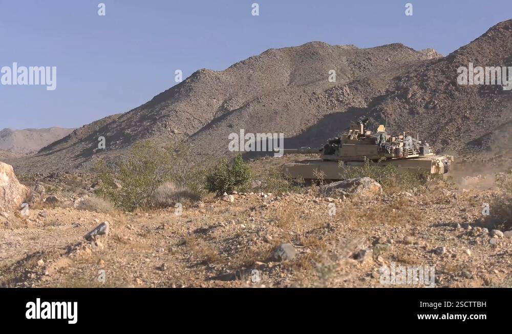 M1A2 Abrams battle tank firing cannon during live fire exercise in ...