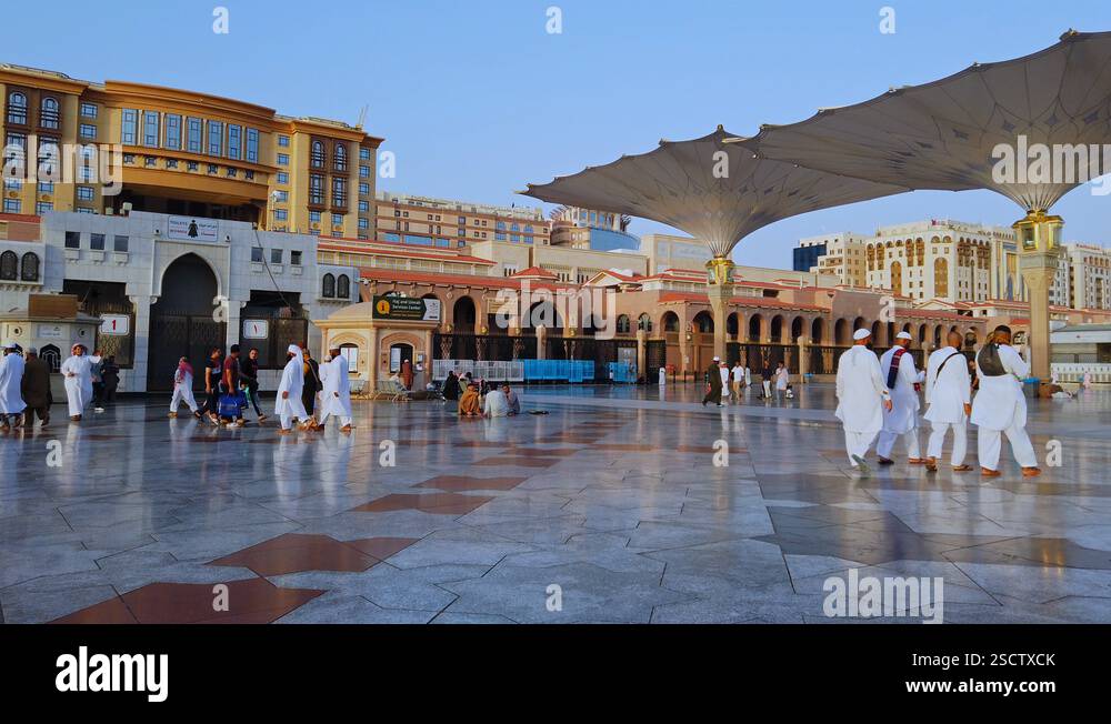 Muslims walk beneath giant canopy at Masjid Al Nabawi in Al Madinah ...