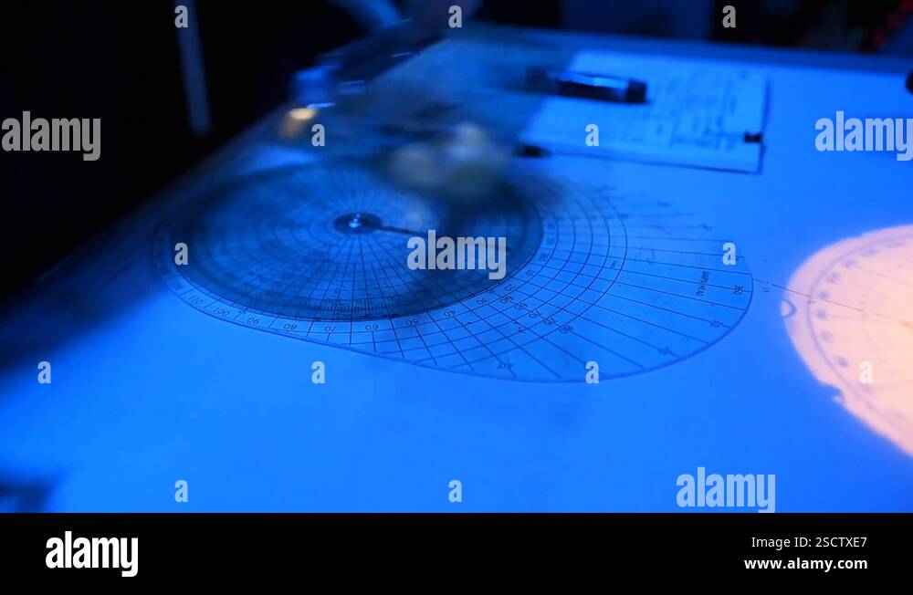 Sailor working on navigation chart in control room aboard USS Mount ...