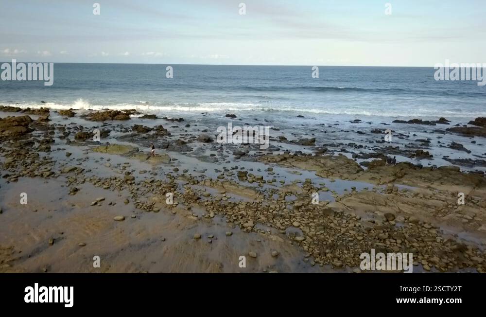 Exploring rock pools at Mooloolaba Stock Video Footage - Alamy