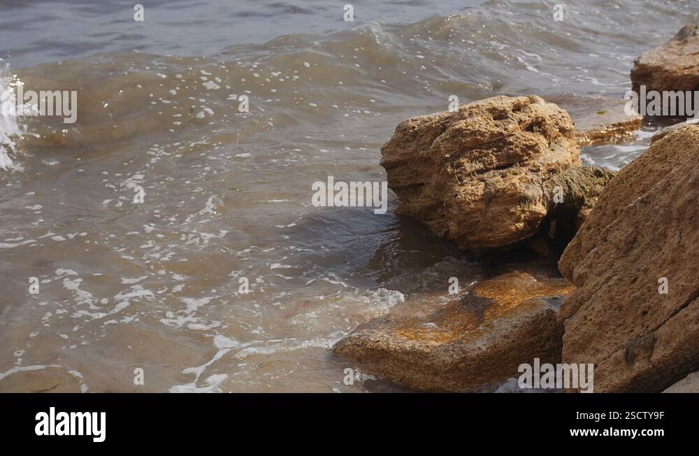 Tide and sea, beach and rock stones background. Sparkling ocean waves ...