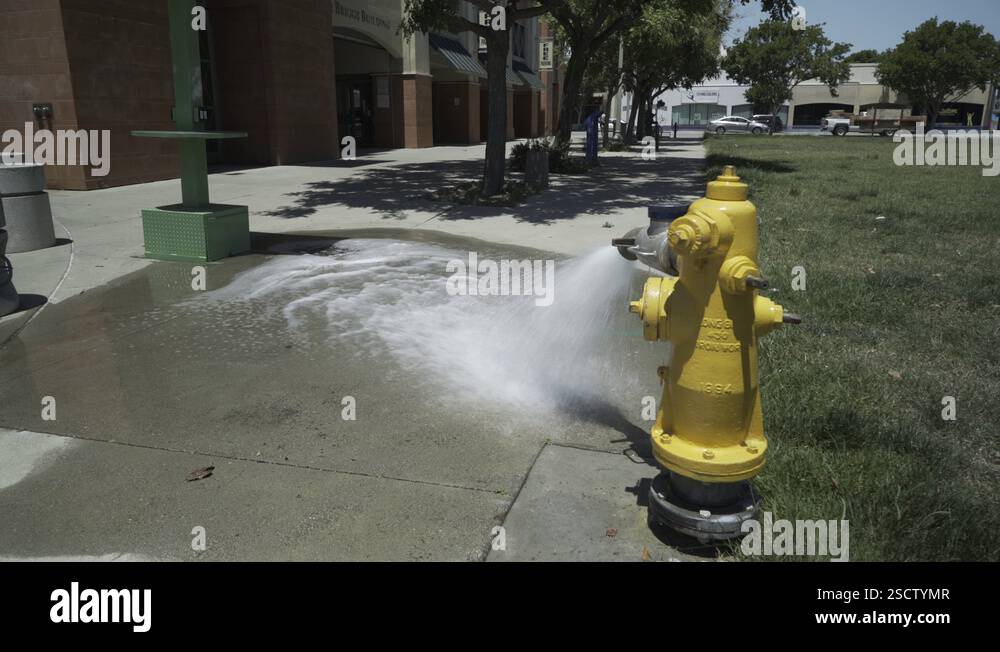 Fire Hydrant spraying water Stock Video Footage - Alamy