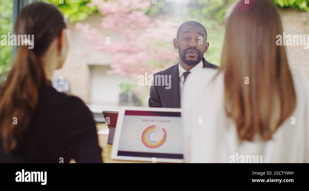 4K Over shoulder view of recruitment team interviewing businessman ...