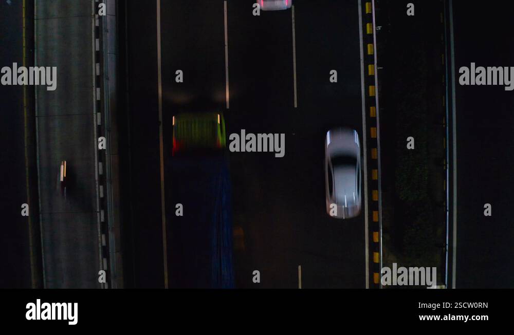 Fast traffic on tollway at night Stock Video Footage - Alamy