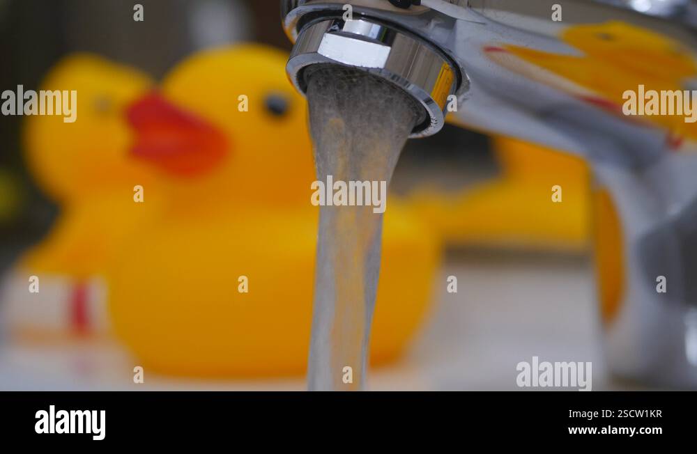 To Turn On Off The Water From The Faucet On A Background Yellow Rubber ...