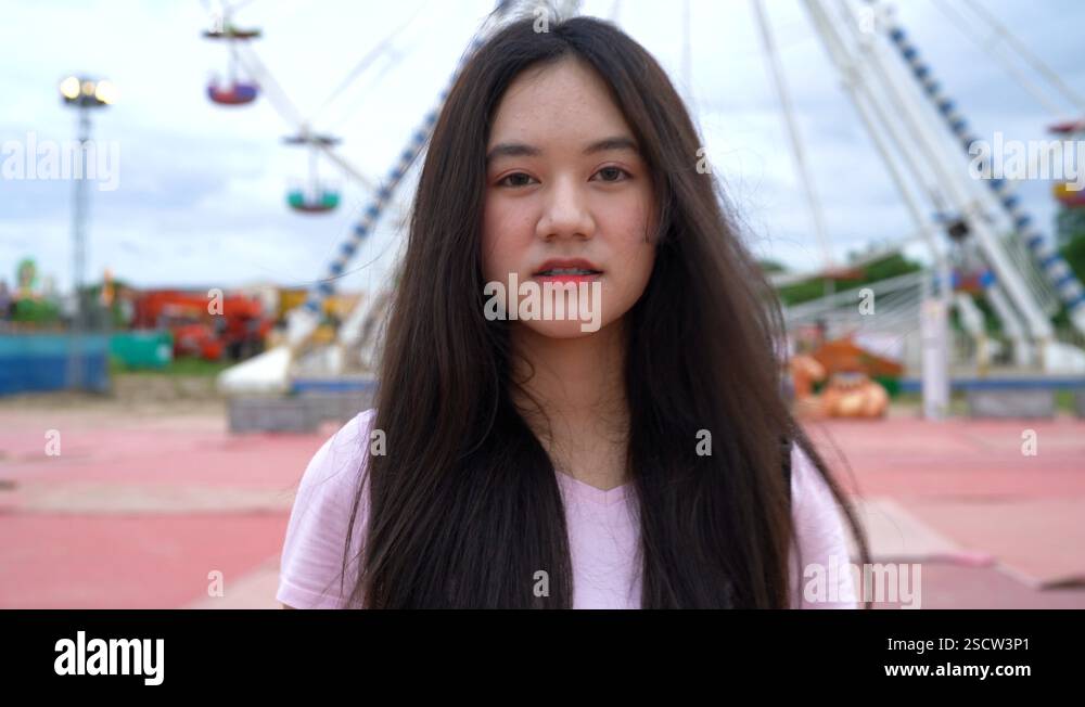 Asian beautiful woman goodbye after playing at amusement park carnival ...