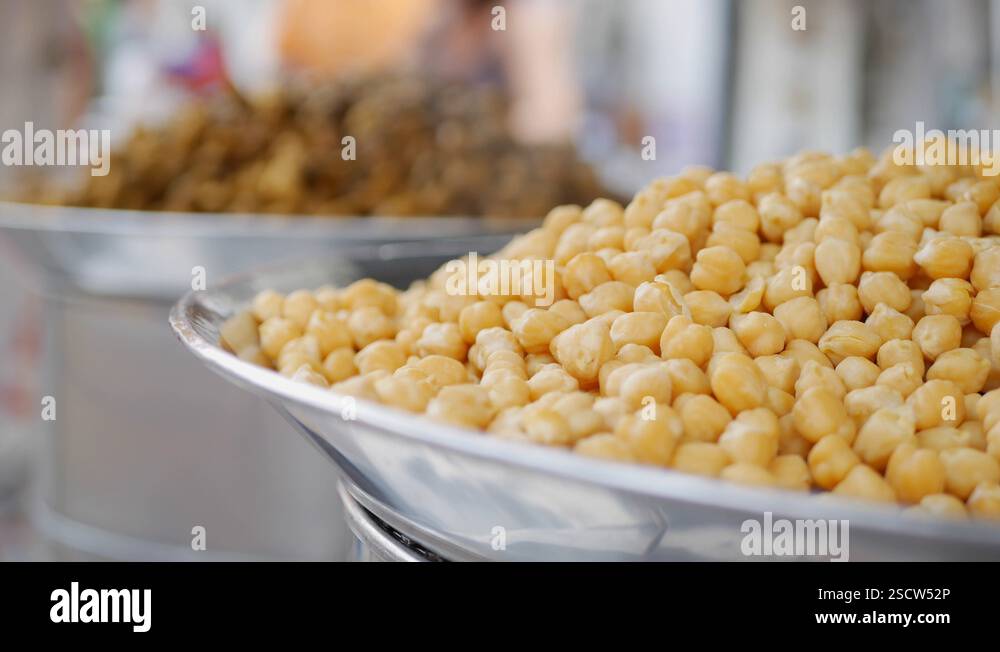 A lot of steaming chickpeas for sale at market. Street food. 4k Stock ...