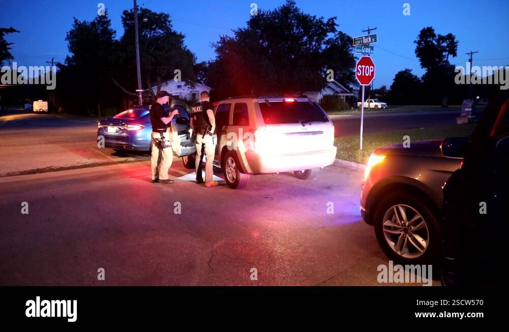 Police officers arresting criminal in vehicle Stock Video Footage - Alamy