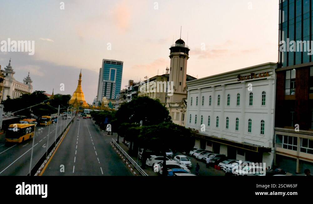 Streets of downtown Yangon on the road to Sule Pagoda timelapse with ...