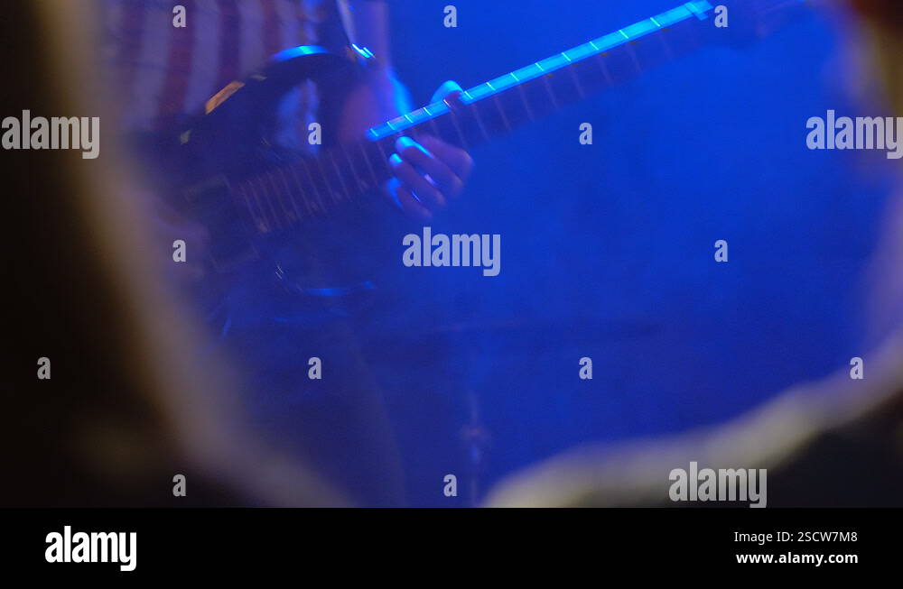 Guitarist rock band plays guitar on stage in spotlight Stock Video ...